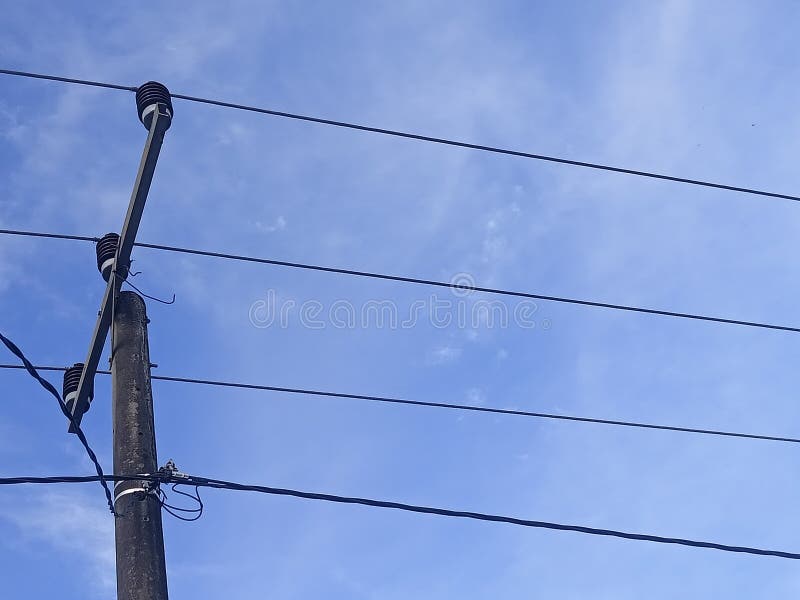 Photo of an Electric Pole Under a Beautiful Blue Sky Stock Photo ...