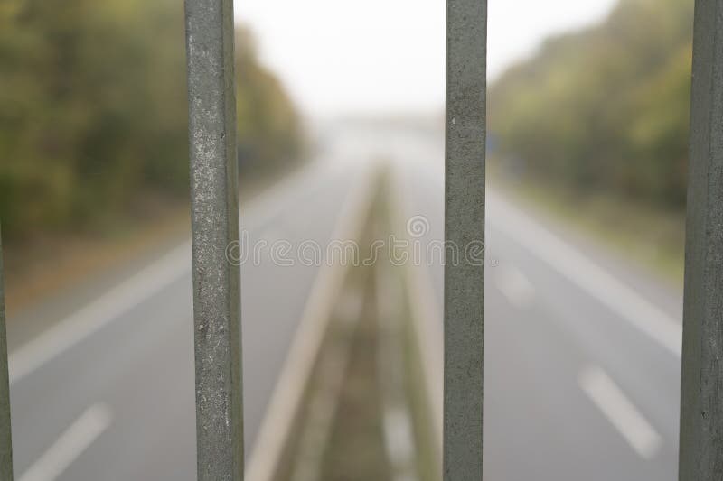 Photo of an Empty Highway through the Fence of the Bridge Stock Image ...