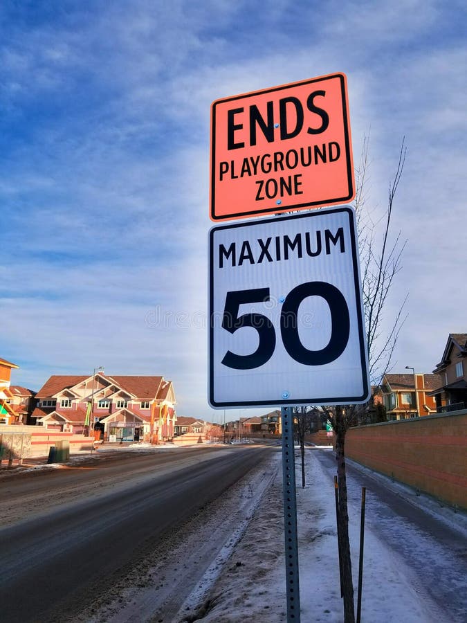 Photo Of Ends Playground Zone Maximum 50 Street Sign Picture. Image ...