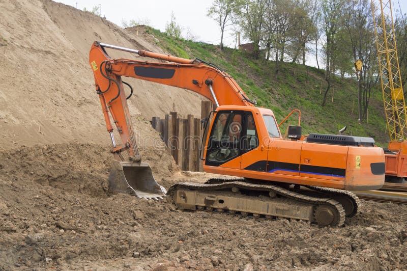 On the Photo Excavator Performs Excavation Work on the Swamp Stock ...