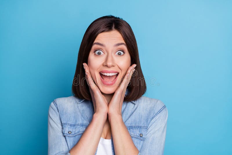 Photo Of Excited Cute Woman Wear Jeans Shirt Arms Cheeks Open Mouth