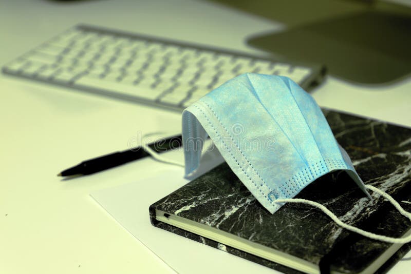 Face Mask on the Office Desk Stock Image - Image of regular, keyboard ...