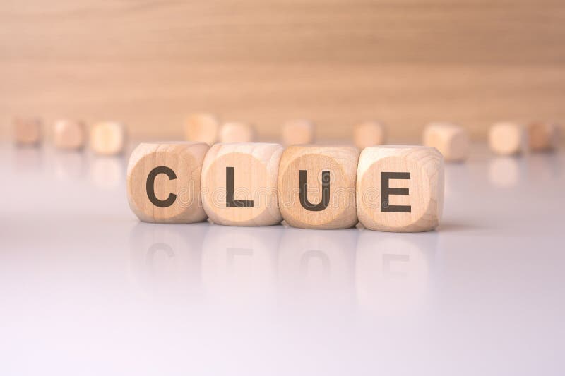 Wooden Cubes with Text Clue, Brown Background Stock Photo - Image of ...