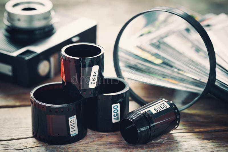Photo Film Rolls, Retro Camera, Photos and Magnifier Stock Image ...