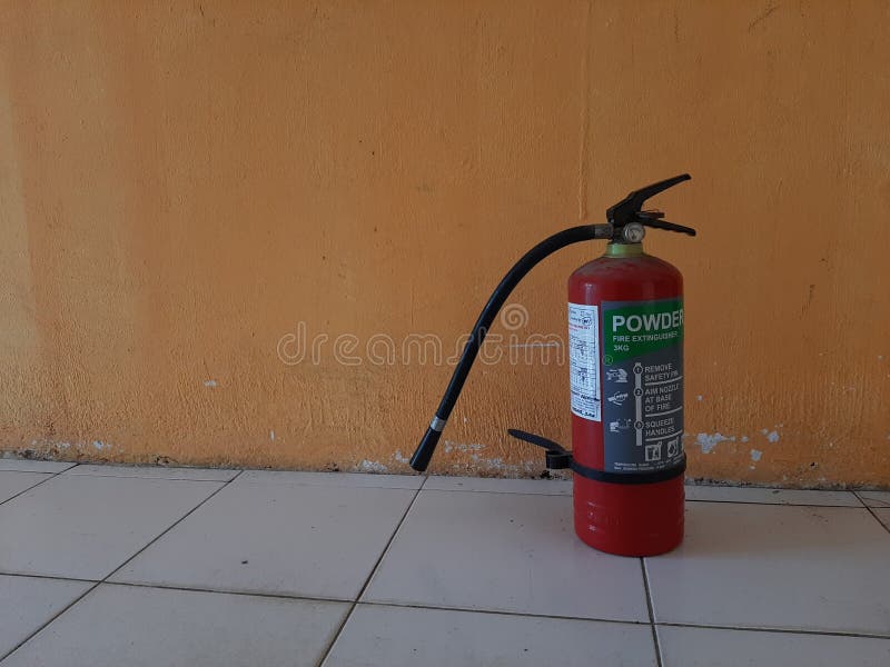Photo of a Fire Extinguisher Taped To the Wall and Ready To Use in an ...