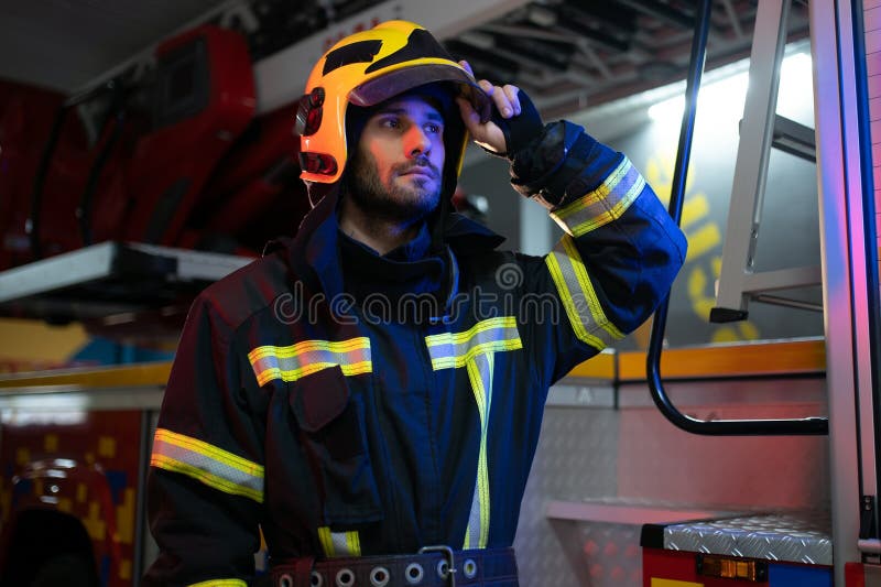 Photo of Fireman with Gas Mask and Helmet Near Fire Engine Stock Image ...