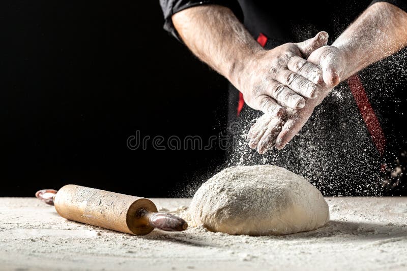 Photo of Flour and Men Hands with Flour Splash. Cooking Bread Stock ...