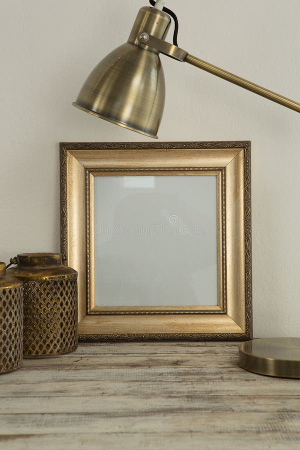 Photo Frame and Table Lamp on Table Stock Photo - Image of container ...