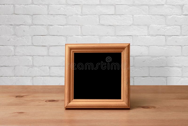 Photo frame on the table stock photo. Image of table - 257657014