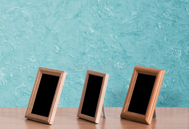 Photo frames on table stock image. Image of gallery - 213530377