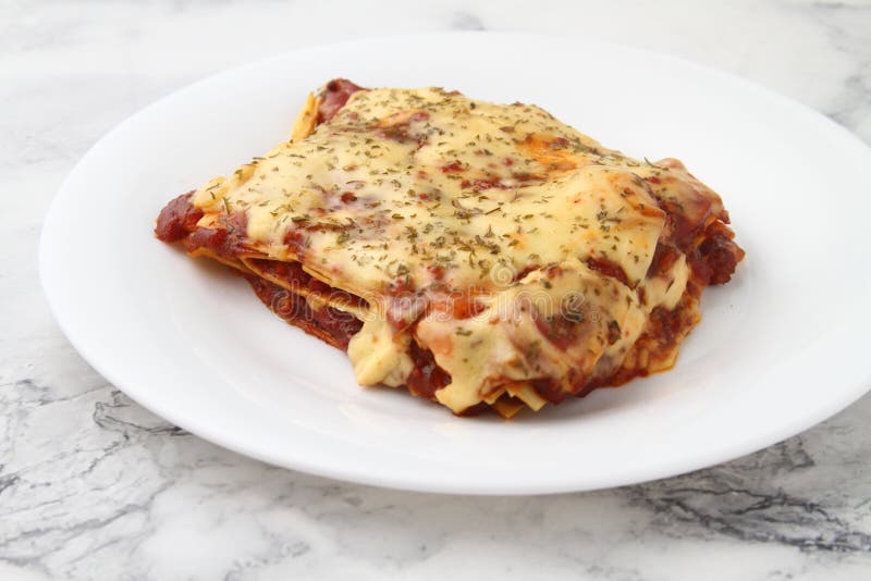 Freshly cooked Lasagna stock photo. Image of plate, delicious - 252856510