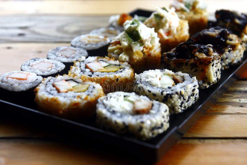 Assorted sushi on a plate stock photo. Image of ingredient - 117876802