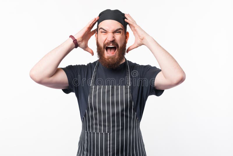 Photo of Frustrated Bearded Chef Looking at the Camera Over White ...