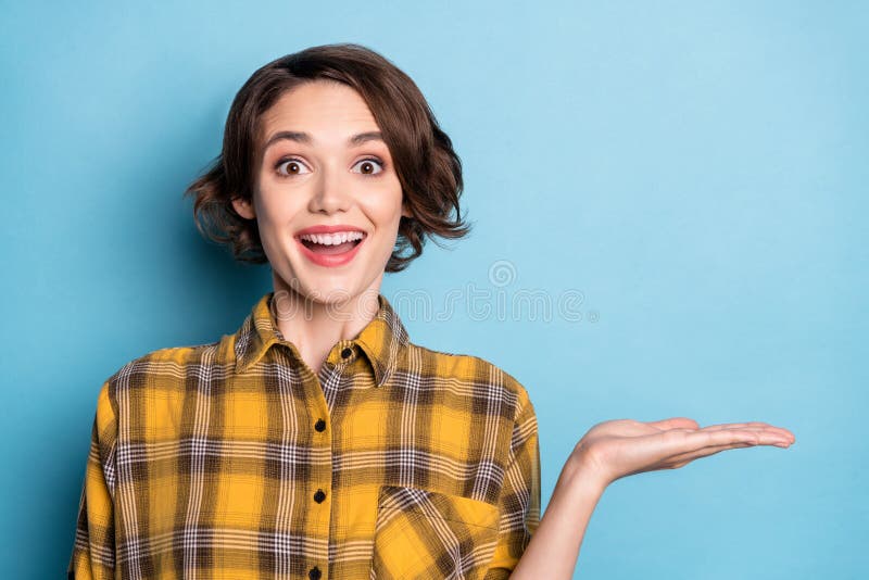 Photo Of Funny Excited Amazed Girl Hand Hold Empty Space Open Mouth