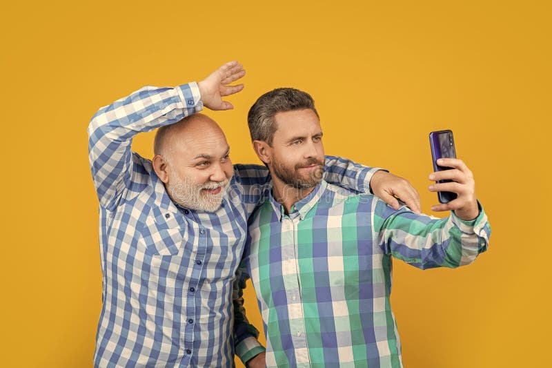 Photo of Glad Generation Men Make Selfie on Phone. Generation Men Make ...