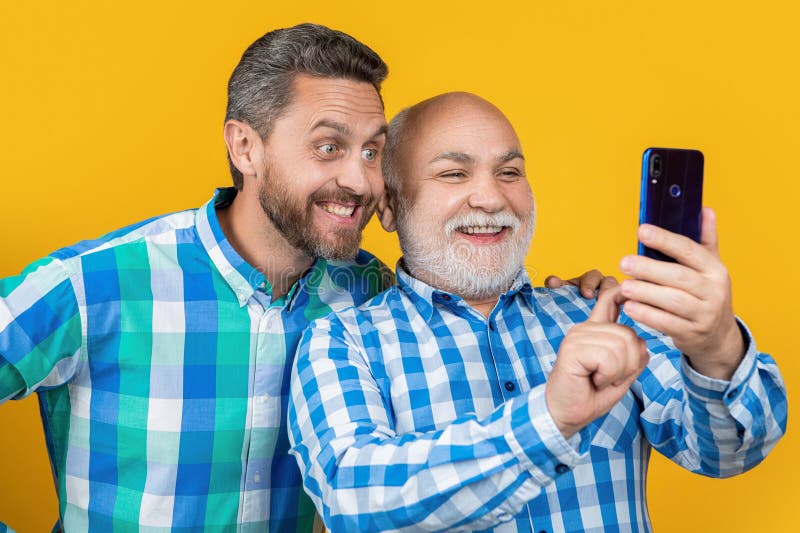 Photo of Glad Generation Men Make Video on Phone. Generation Men Make ...