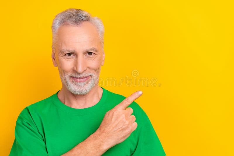 Photo Of Good Mood Cheerful Man Wear Green T Shirt Showing Finger Empty