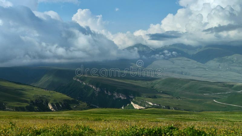 In the Photo, a Green Mountain Landscape with a View of the Canyon ...