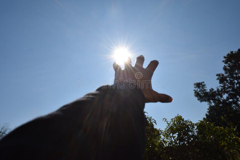 Photo of a Hand Approaching Sun. Stock Image - Image of autumn, bright ...