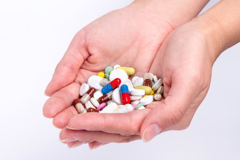 Photo Handful of Hands Full of Pills and Capsules Stock Photo - Image ...