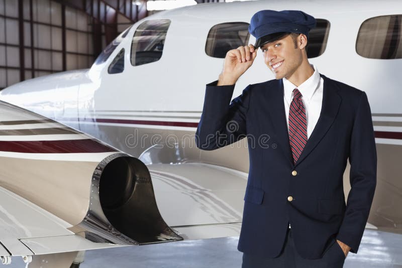 Portrait of Handsome Young Pilot Standing in Front of Private Airplane ...