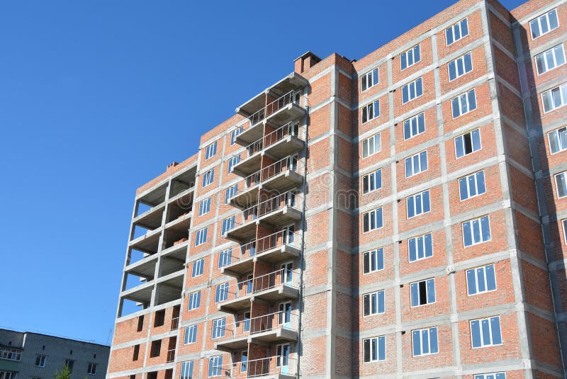 A New Brick High-rise Residential Building is Constructed with the Help ...