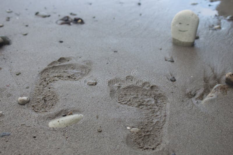 Photo of Human Footprints in the Sand Stock Image - Image of freezing ...