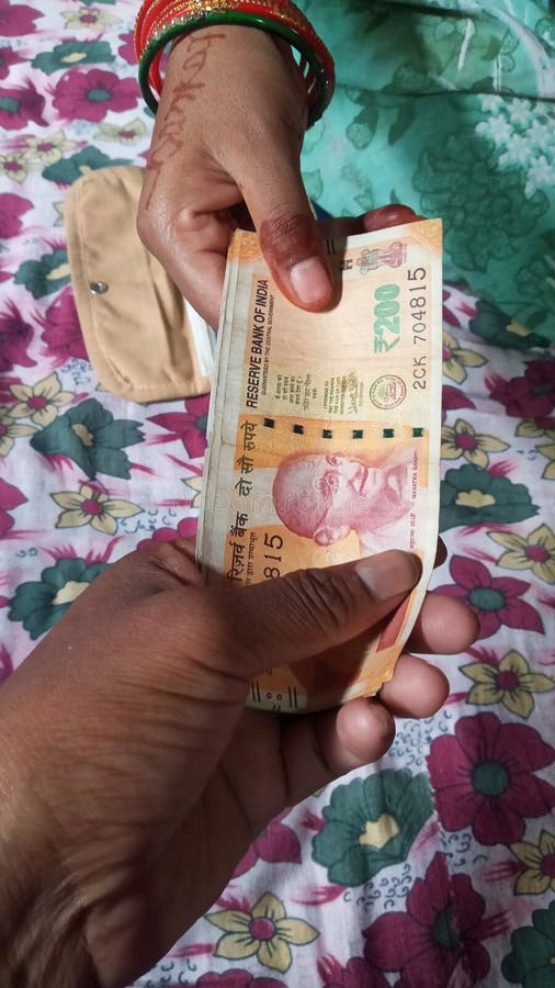Photo of Indian Currency Bank Note Taking a Human Hand Stock Image ...