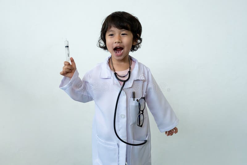 Photo of Kid Doctor with Stethoscope and Syringe on White Background ...