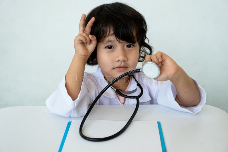 Photo of Kid Doctor with Stethoscope on White Background Stock Photo ...