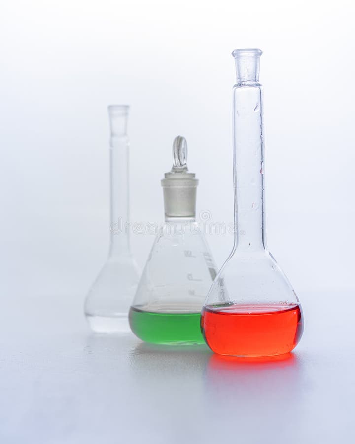 Laboratory Glass Flasks with Multicolored Liquid Isolated on White ...