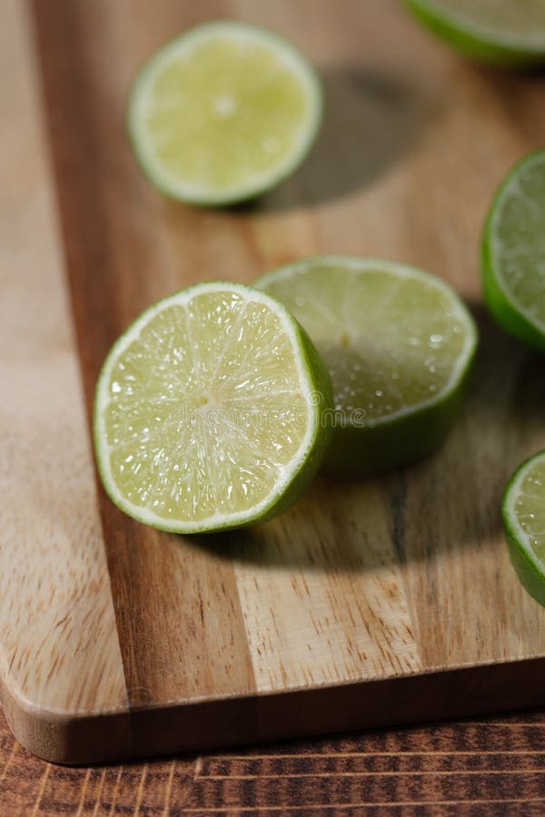 Cut Up Lime on the Cutting Board Stock Image - Image of produce ...
