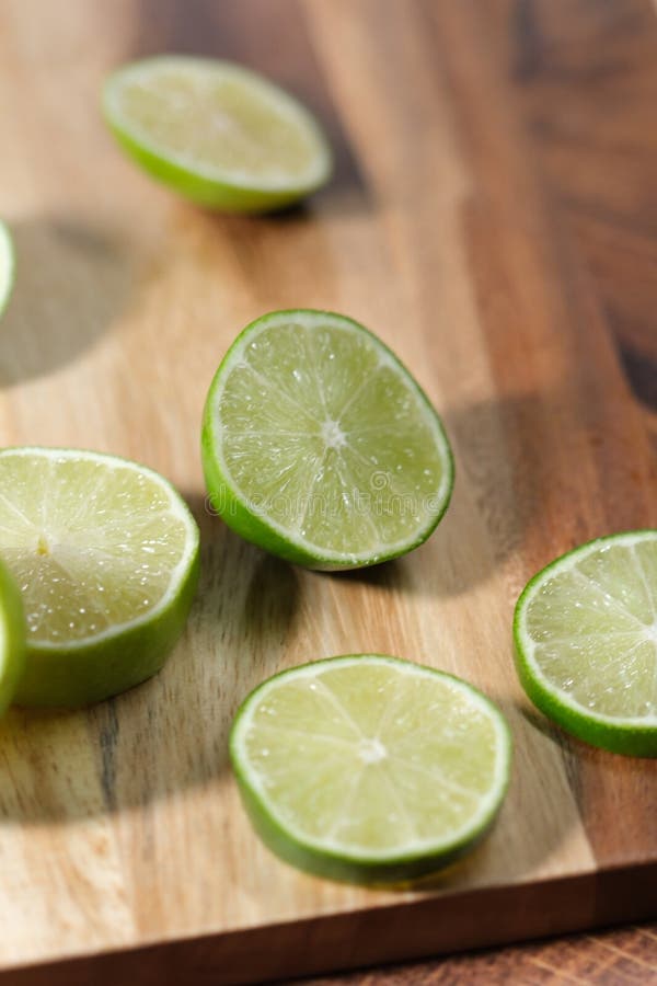 Cut Up Lime on the Cutting Board Stock Image - Image of produce, citrus ...