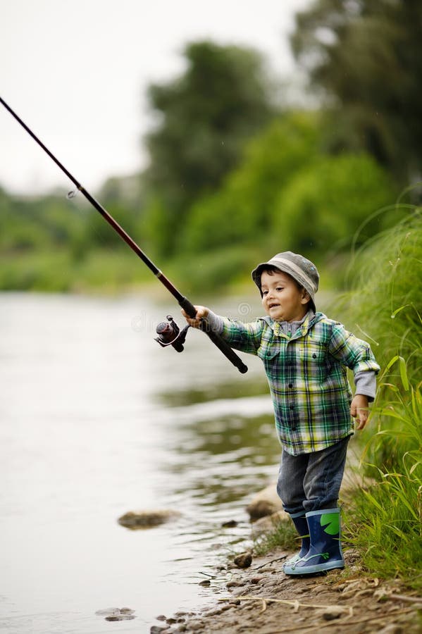Photo Of Little Boy Fishing Stock Image - Image: 28251597