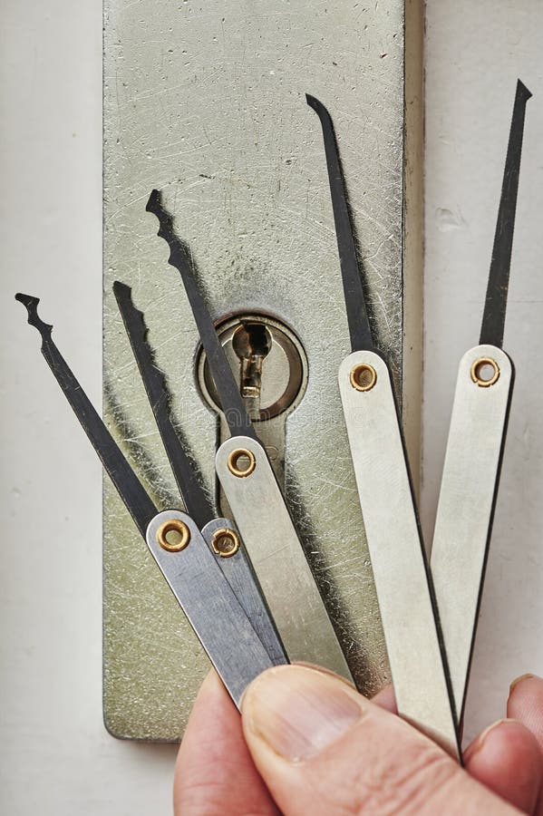 Photo of Lockpicks in Front of a Closed Door Stock Image - Image of ...