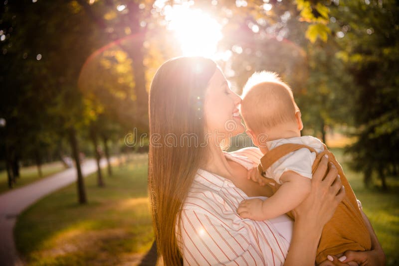 Photo Of Lovely Pretty Sweet Lady Mom Cuddle Her Beloved Son Infant