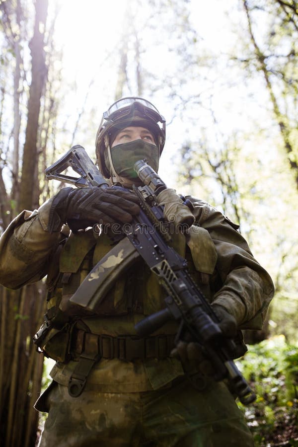 Photo of man with gun stock image. Image of helmet, people - 93542449