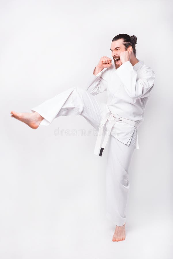 Photo of Man Practicing Taekwondo and Making a Kick with Leg Stock ...