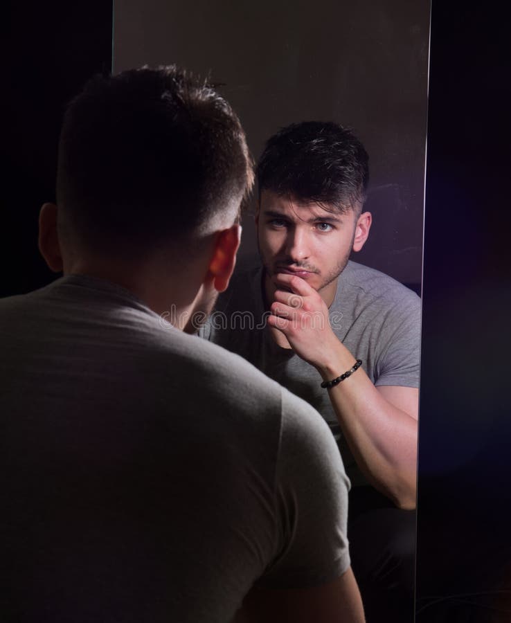 Photo of a Man Reflecting on Himself in the Mirror Stock Photo - Image ...