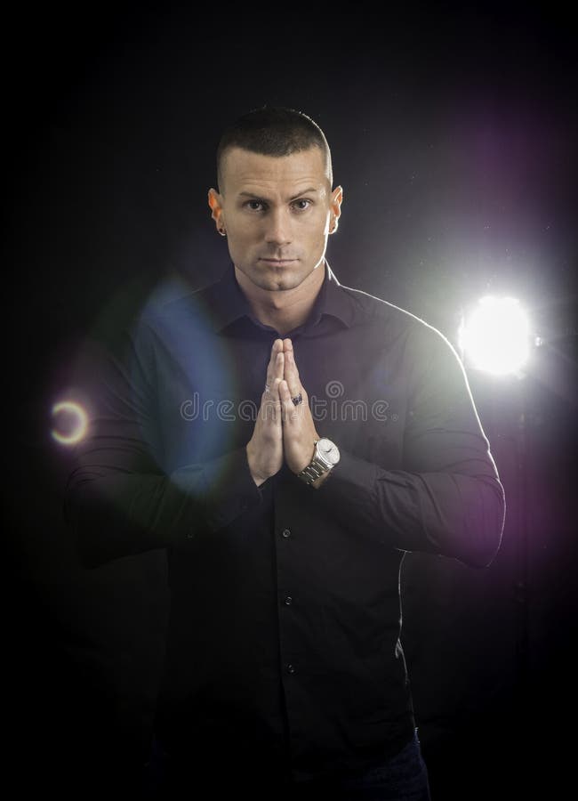 Photo of a Man Standing in Front of a Spotlight Stock Photo - Image of ...