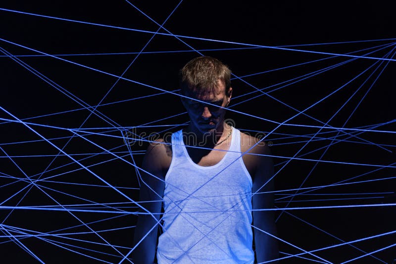 Photo of a Man Tangled in White Threads in Ultraviolet Stock Photo ...