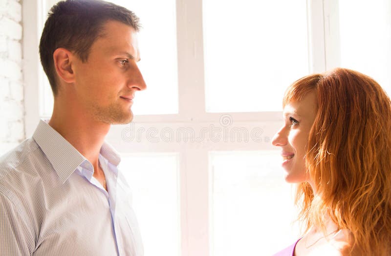 Man And Woman Standing Next To Each Other