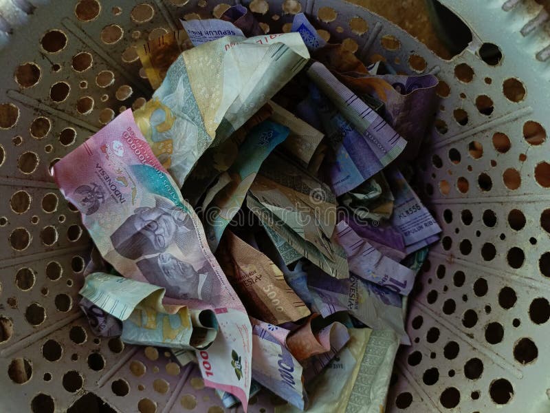 Photo of Money in a Waste Basket Stock Image - Image of keranjang ...