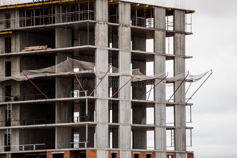 A Multi-storey Building Under Construction Against a Gray Sky Stock ...
