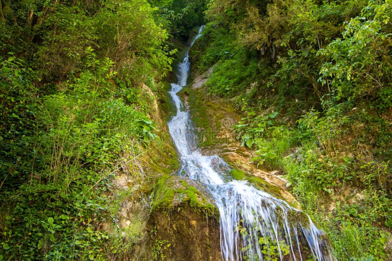 Narrow Waterfall in a Cliff Face in New Zealand Stock Photo - Image of ...