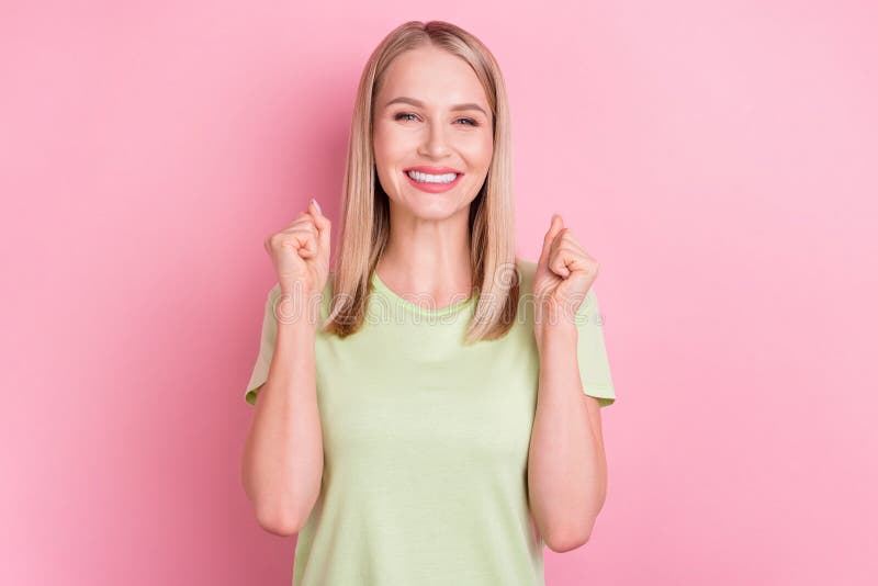 Photo Of Nice Astonished Positive Lady Hold Fists Shiny White Smile