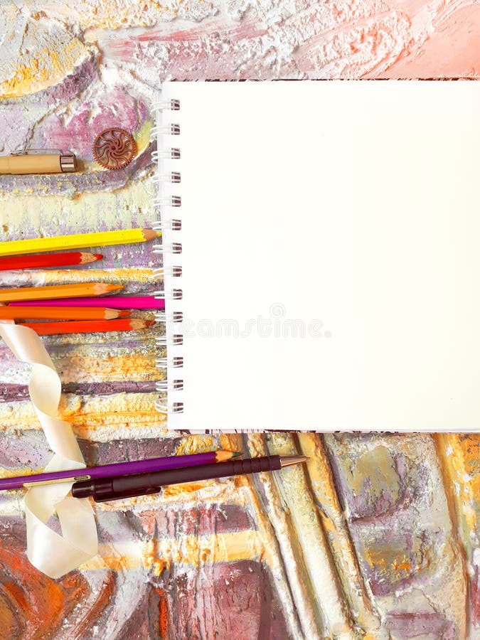 Photo of Notepad Against the Background of a Relief Wall with Color ...