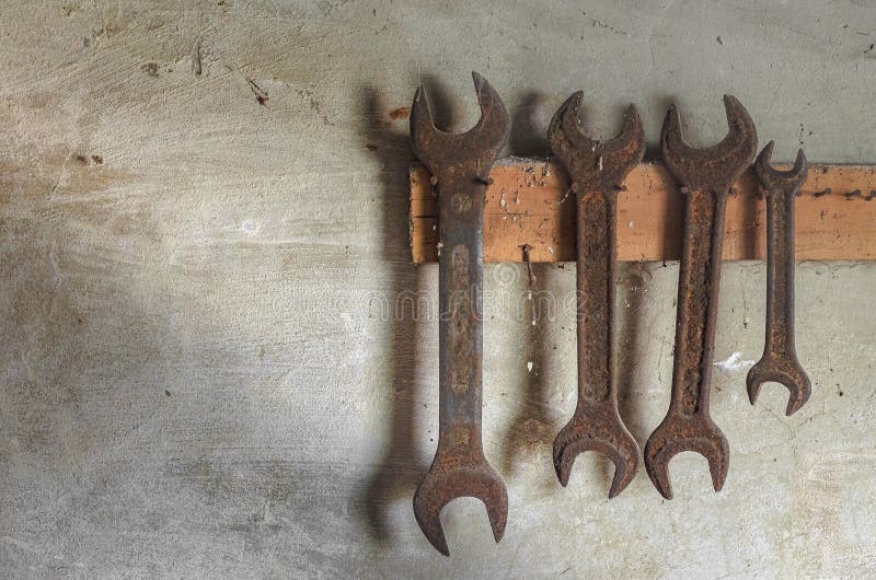 Photo of Old Rusty Tools that are Hanging in the Garage on the Wall ...
