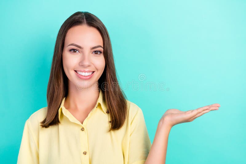 Photo Of Optimistic Millennial Brunette Lady Hold Empty Space Wear