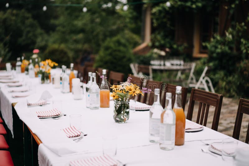 Photo of an Outdoor Long Table at a Wedding Stock Photo - Image of ...